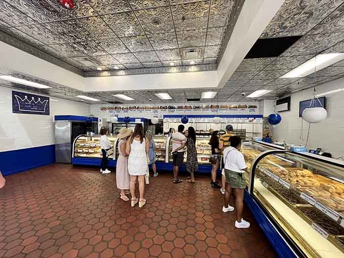 Step inside where gleaming cases stretch endlessly, displaying more Italian pastries than you knew existed in the universe.