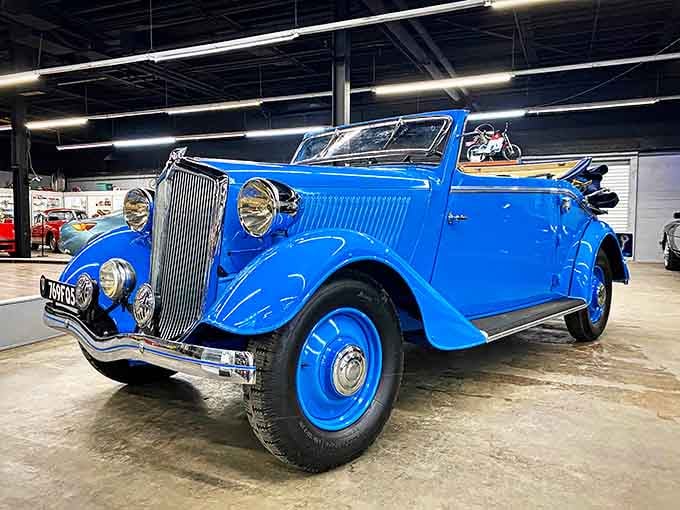 This stunning blue convertible looks ready to whisk you away to a simpler, more elegant era.
