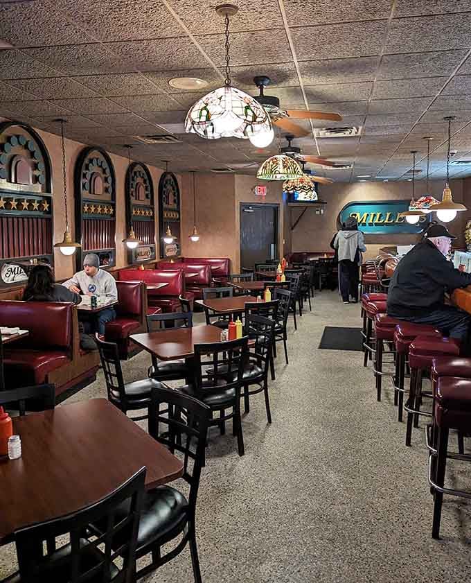 Classic vinyl booths and ceiling fans create the kind of timeless atmosphere money can't buy, only decades can.