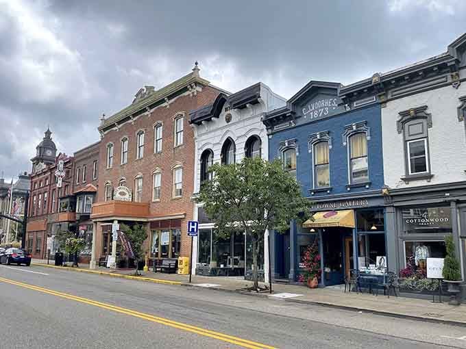 Historic storefronts line the streets where architectural details actually matter and buildings have personalities instead of corporate blandness.