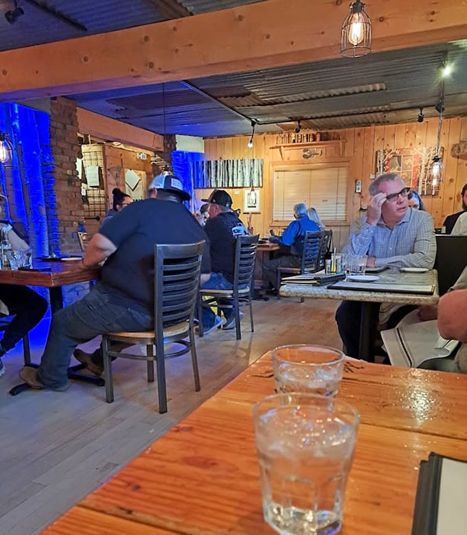 Wood paneling and blue accent lighting create an atmosphere that's equal parts historic charm and modern comfort.