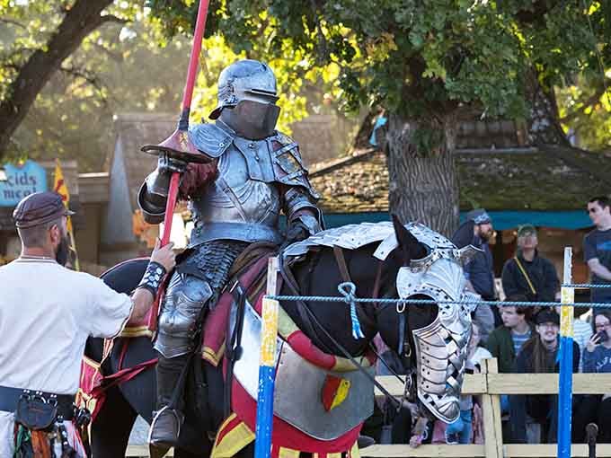 Knights in full armor prepare for battle while modern crowds watch this timeless spectacle unfold.
