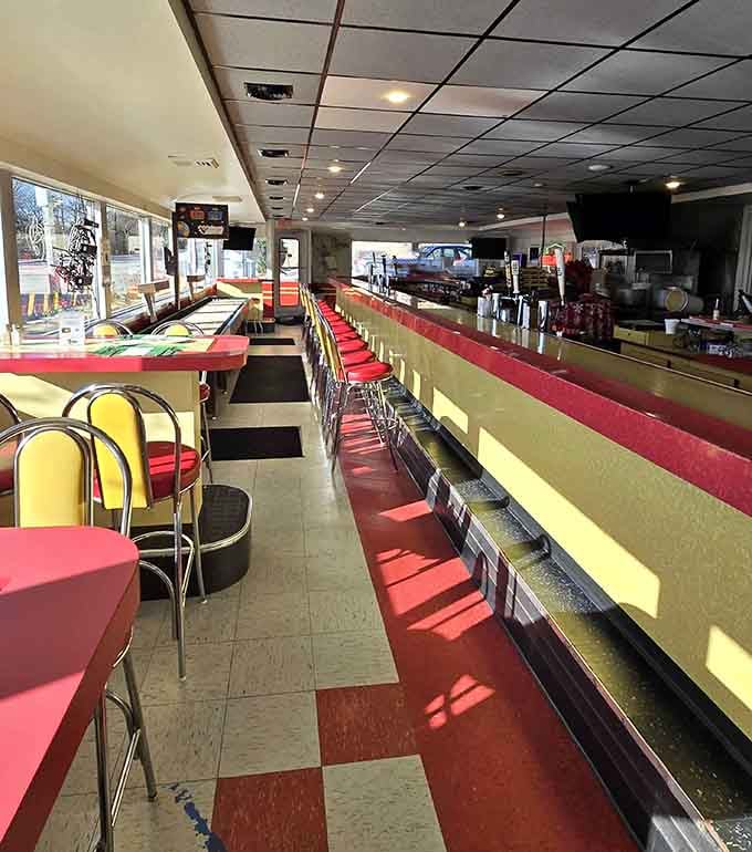 Red vinyl, chrome accents, and checkered floors: the holy trinity of authentic American diner design done right.