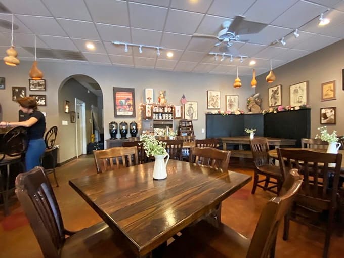 Wooden tables, vintage artwork, and pendant lighting create a space that feels like brunch at your coolest friend's house.