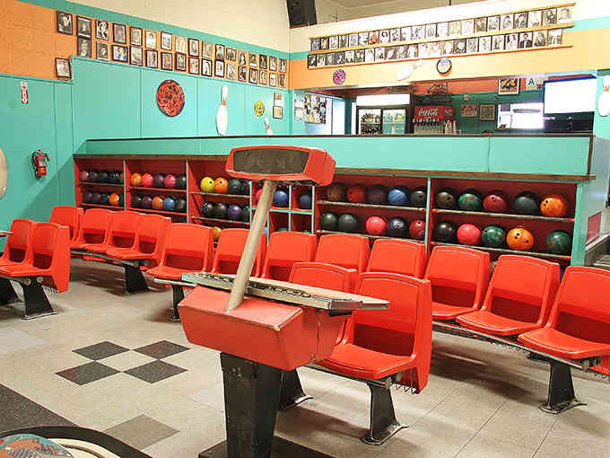 Orange molded chairs and turquoise walls create a color scheme that would make Don Draper nostalgic.
