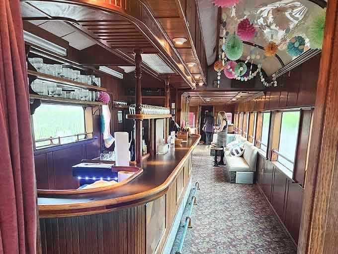 Wood paneling, festive decorations, and a full bar, because apparently someone finally figured out how trains should work.
