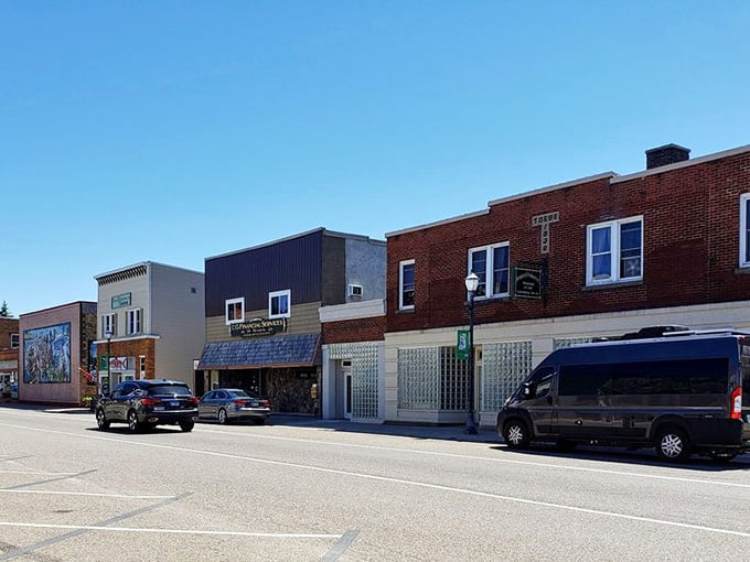 Main Street Munising offers the kind of walkable downtown where parking spots outnumber your stress levels significantly.