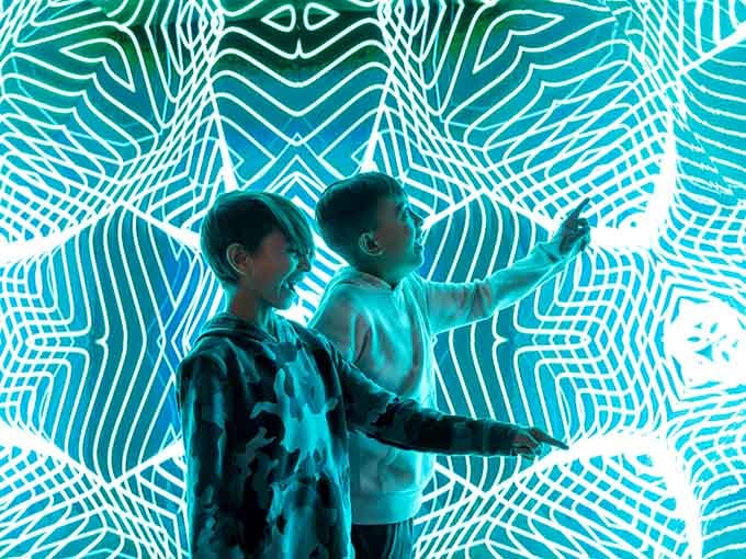 When glowing blue waves become your backdrop, you're not just taking a photo, you're creating art that'll break Instagram.