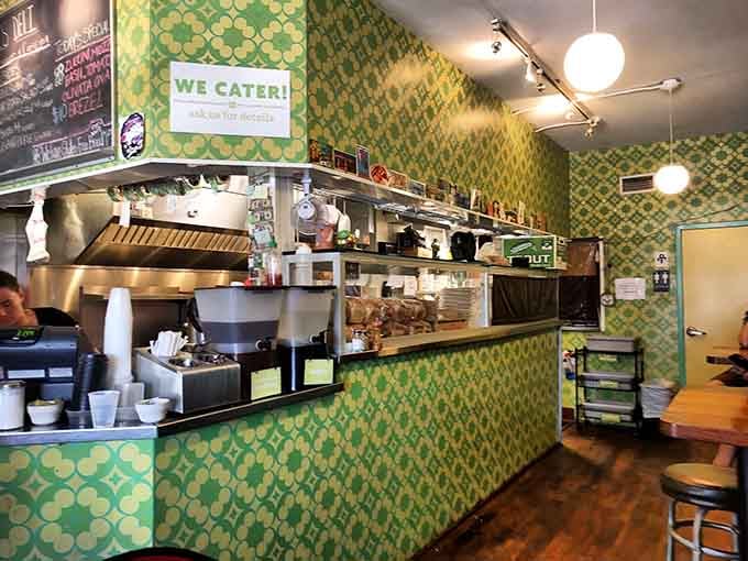 The retro green patterned counter adds personality without pretension, just like the food they're serving up.