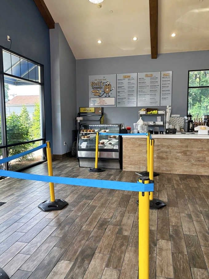 Modern meets timeless inside, where vaulted ceilings and wood-toned floors create a surprisingly elegant stage for serious donut business.