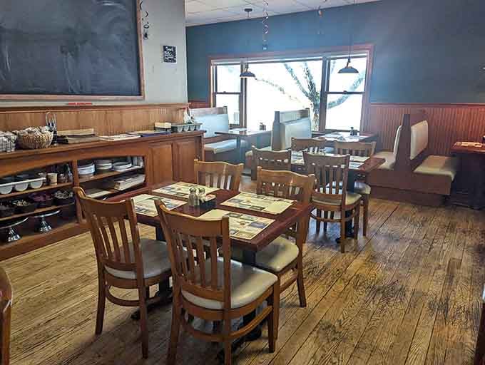 Wood tables, cozy booths, and a chalkboard menu create the kind of welcoming atmosphere that makes strangers feel like regulars.