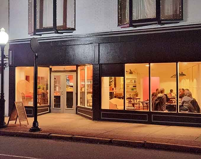 Evening light transforms storefronts into warm beacons of possibility, inviting you to discover what's cooking inside these creative spaces.