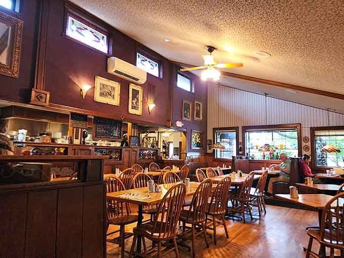 Wood tones and natural light create the kind of welcoming space where strangers become friends over coffee refills.