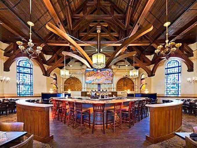 Cathedral ceilings and circular bars create the kind of atmosphere that makes you want to stay forever, honestly.