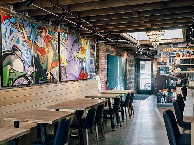 Colorful murals and exposed brick create the perfect backdrop for your upcoming battle with gravity-defying sandwiches.