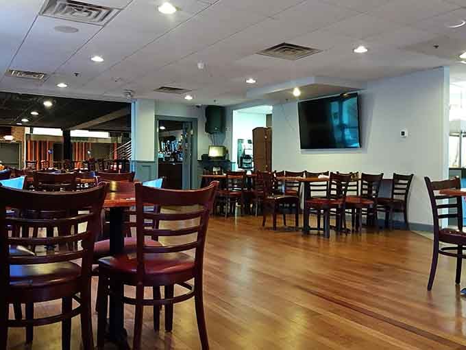 Spacious dining room with dark wood tables ready to support the weight of your ambitious eating plans.