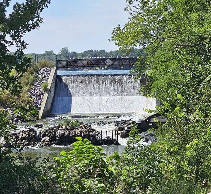 This dam creates one of nature's most photogenic moments, where water cascades like liquid silver through Wisconsin's green heart.