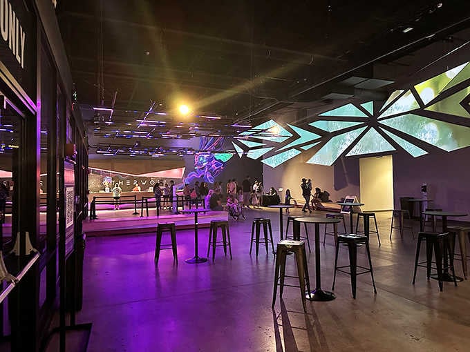 The bar area glows with artistic flair, proving even your drink break exists in another dimension.