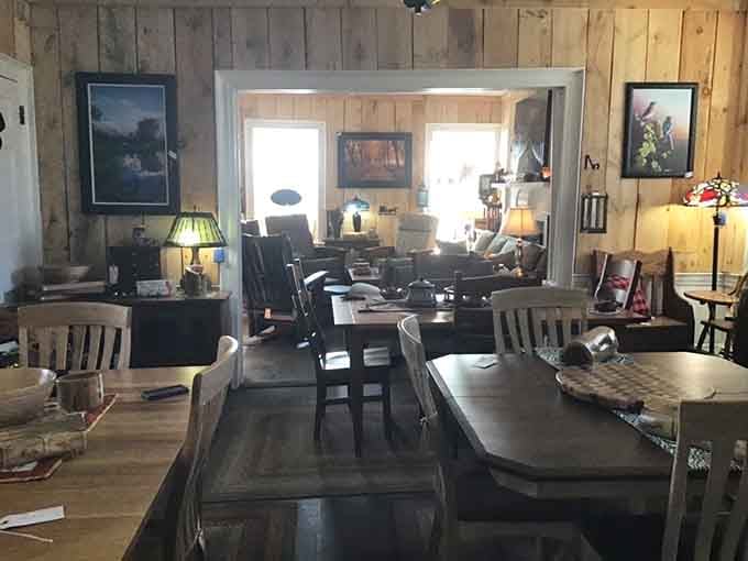 Natural light floods the showroom, illuminating handcrafted pieces that make particle board weep with inadequacy.