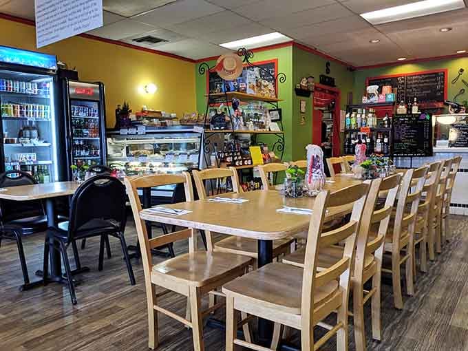 Bright walls and communal tables create the kind of welcoming space where strangers become friends over shared pasta plates.