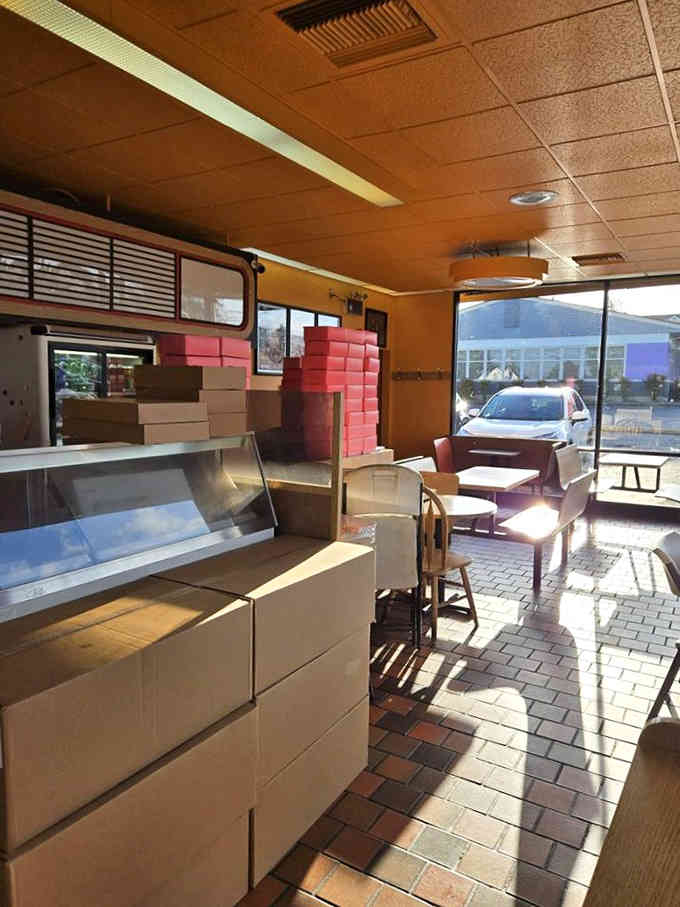 Morning light streams across classic tile floors where generations have gathered for their daily donut ritual.