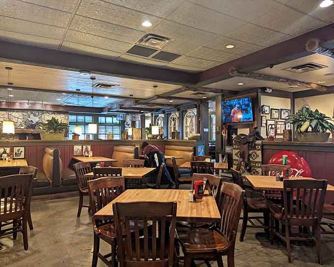 Wood tables, booth seating, and TVs playing in the background: this is where Houston comes to relax.