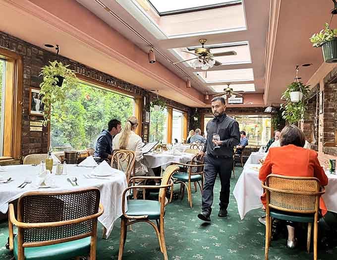 Skylights and white tablecloths create an atmosphere where Sunday dinner meets sophisticated dining without the stuffiness.