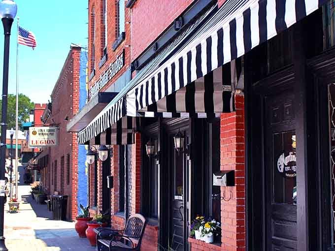 Those striped awnings and flower boxes aren't trying too hard, they're just being effortlessly photogenic on a Tuesday.