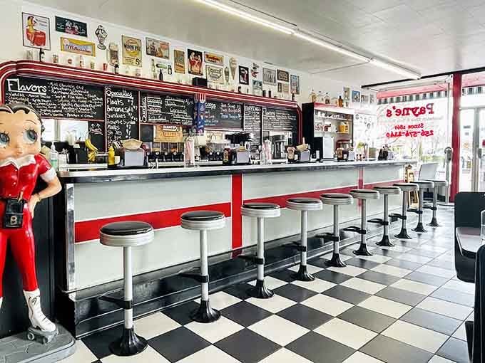 Chrome stools, checkered floors, and a Betty Boop keeping watch over the counter where magic happens daily.