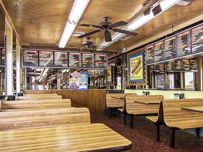 Classic booth seating and overhead menus create the perfect stage for serious burger contemplation and decision-making.