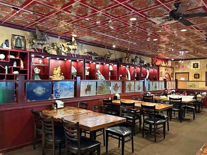 Those aquariums and red accents create an atmosphere that's both elegant and welcoming, perfect for your culinary marathon.