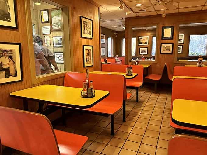 Wood paneling, orange booths, and yellow tables create a time capsule where the only thing that matters is meat.