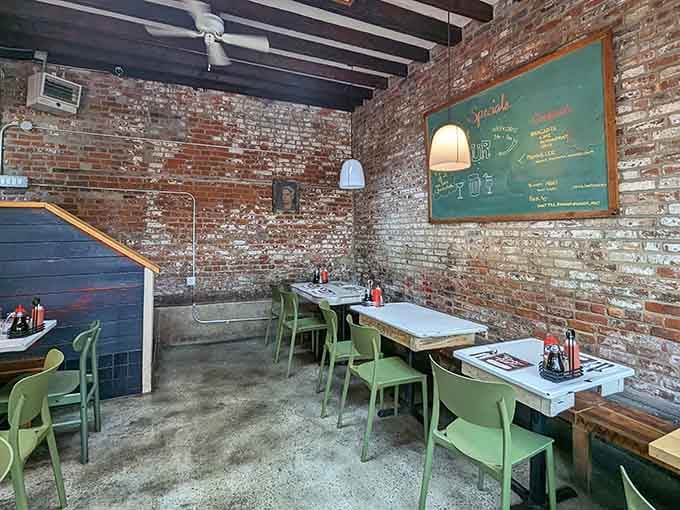 Exposed brick walls tell stories of countless satisfied customers who've discovered this crispy, golden treasure trove of comfort.
