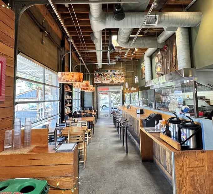 Industrial chic meets Southern comfort in a space where exposed ducts somehow make biscuits taste even better.