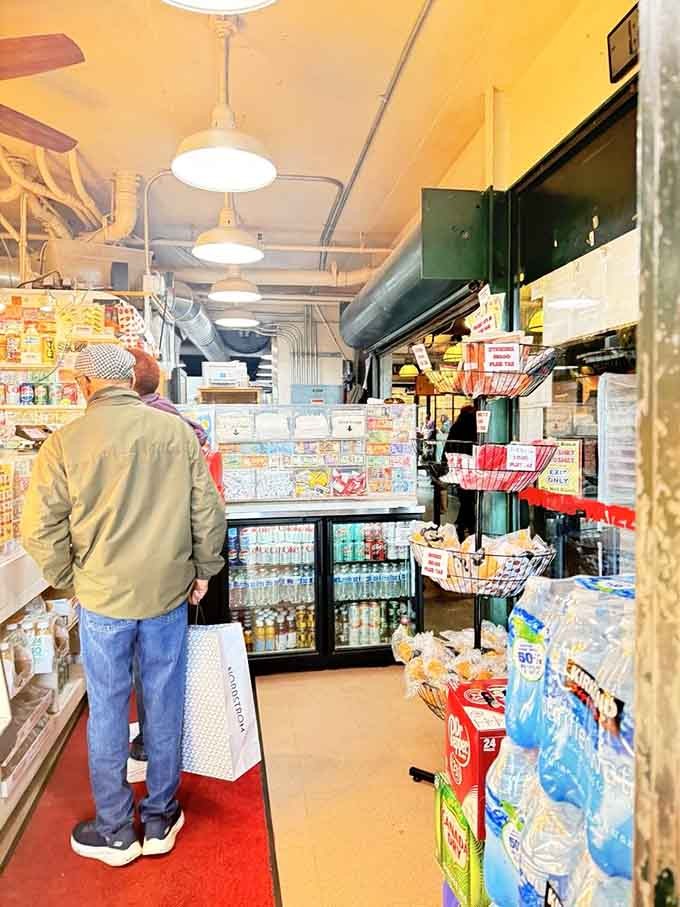 That cheerful yellow ceiling and industrial charm create the kind of no-nonsense vibe where great food does all the talking.