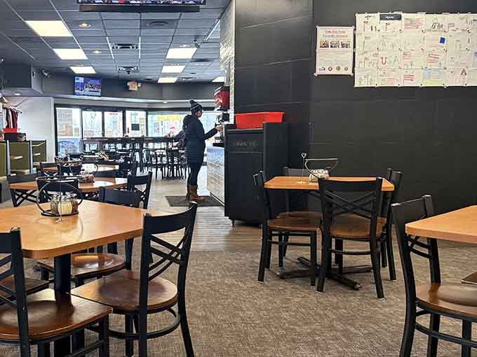 Simple tables, honest chairs, and an atmosphere that says "relax, you're among friends who appreciate good pizza."