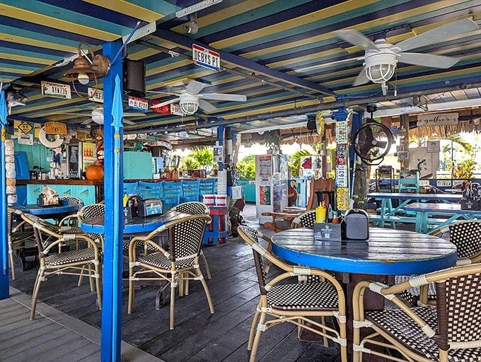 License plates and nautical treasures create a cozy chaos that feels like your favorite uncle's beach house.