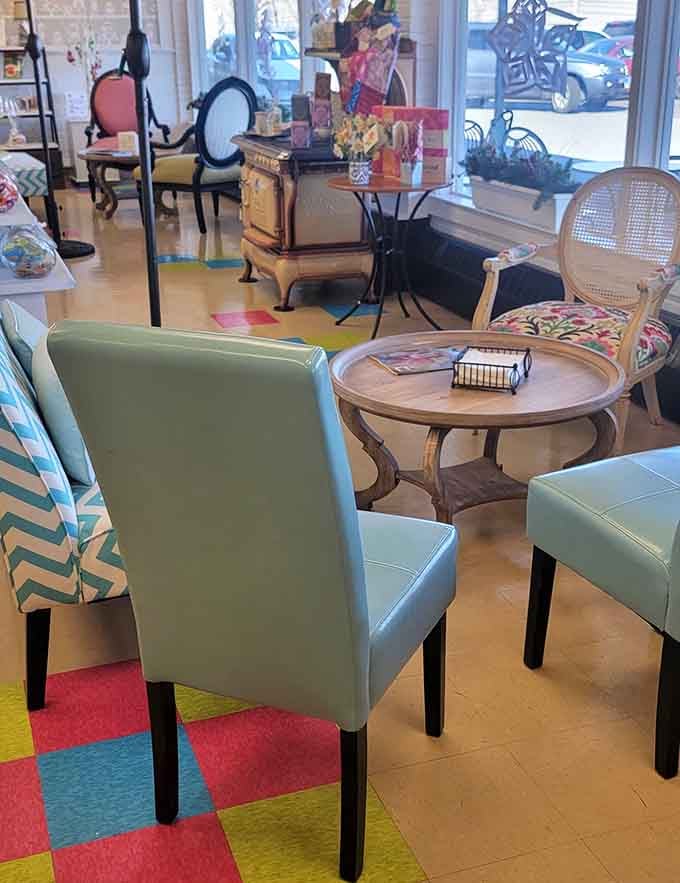 Mismatched vintage furniture creates a cozy living room vibe where lingering over croissants feels absolutely right.