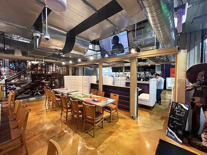 Modern industrial chic meets cozy neighborhood spot, where exposed ductwork somehow makes everything taste even better than expected.