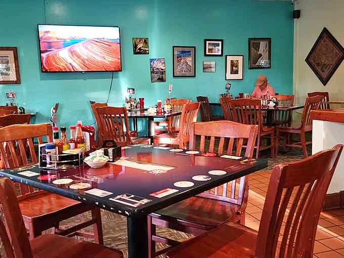 Turquoise walls and warm wood create the kind of comfortable atmosphere where nobody's rushing you through your mashed potatoes.