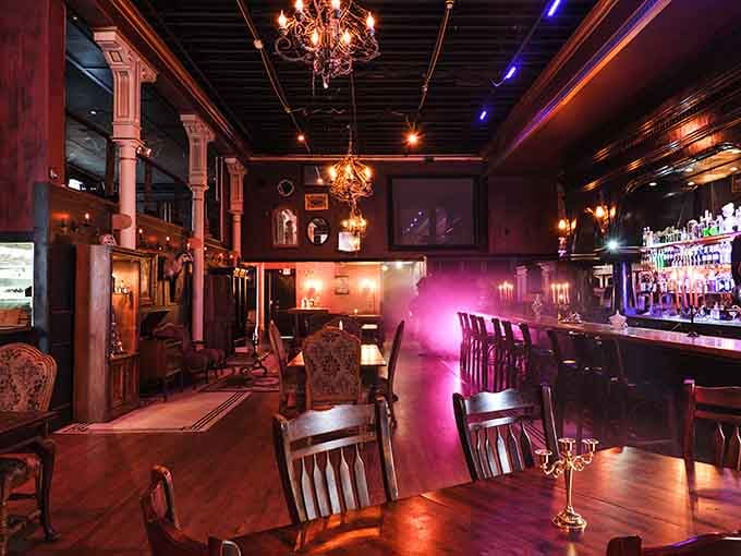 Victorian elegance meets modern mixology in a space where even the chandeliers have a dark side.