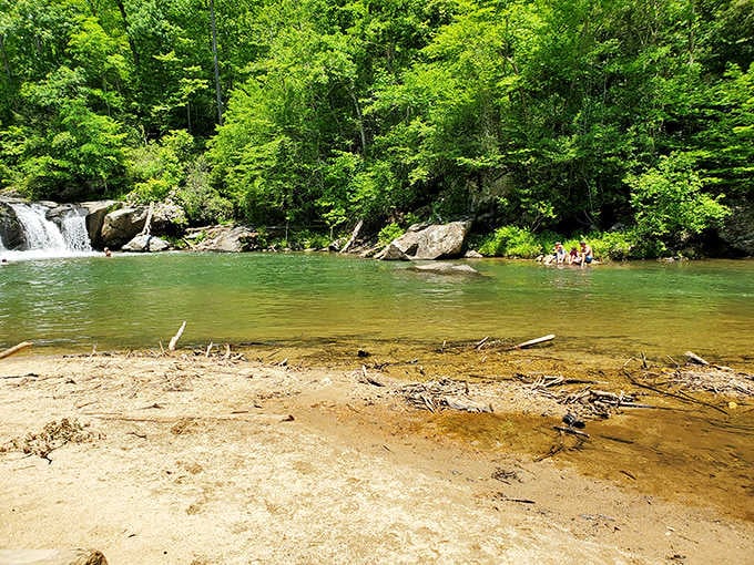 The swimming hole stretches out like a mountain oasis, complete with sandy beaches that didn't require a beach vacation budget.