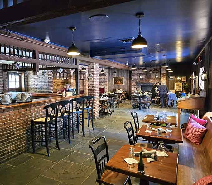 Exposed brick and industrial lighting create the kind of atmosphere where both first dates and anniversaries feel equally right.