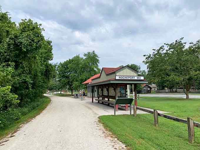 The trailside pavilion welcomes weary cyclists like an old friend offering lemonade on a hot day.