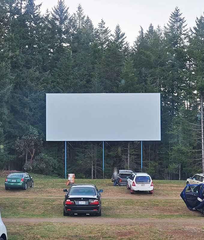 When the blank canvas awaits its nightly masterpiece, framed perfectly by Washington's towering forest sentinels.