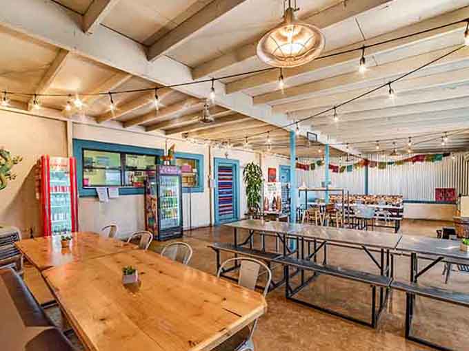 Communal tables, string lights, and exposed beams create the perfect setting for serious taco contemplation and joy.
