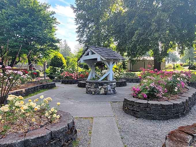 This charming wishing well sits ready to collect your dreams, surrounded by roses that already came true.