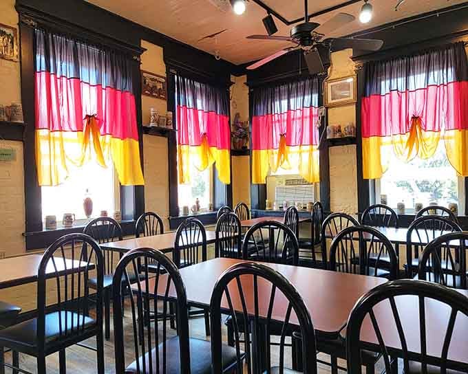 German flag curtains frame every window like patriotic theater curtains before the delicious show begins on your plate.