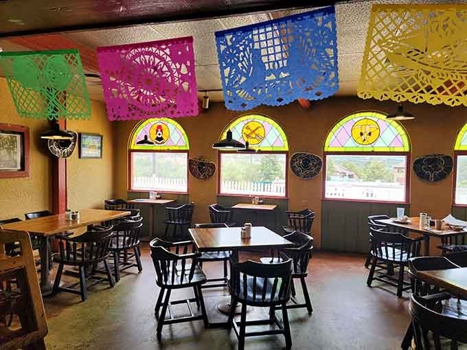 Colorful papel picado banners and cheerful decor create a welcoming atmosphere that feels like home.