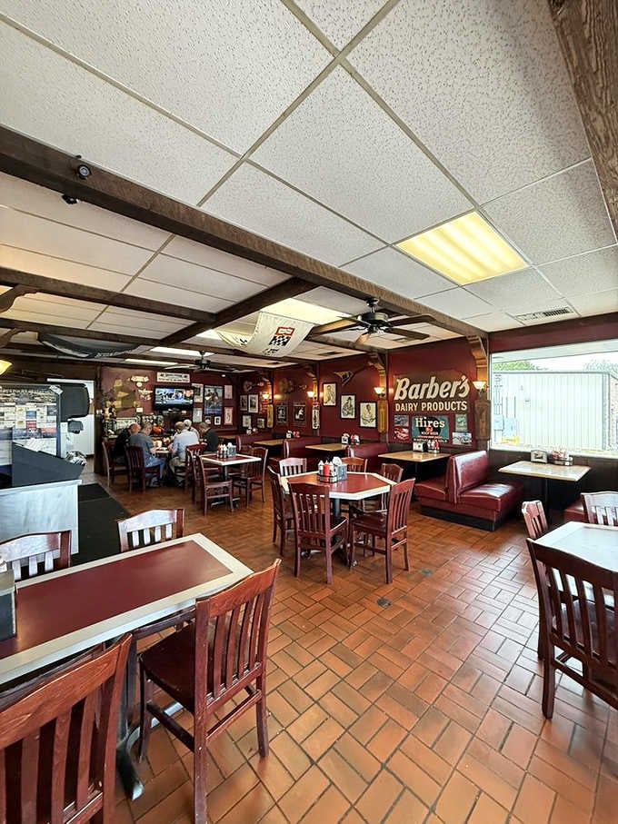 Vintage signs and burgundy walls create the perfect backdrop for serious eating, where comfort meets genuine Southern hospitality.
